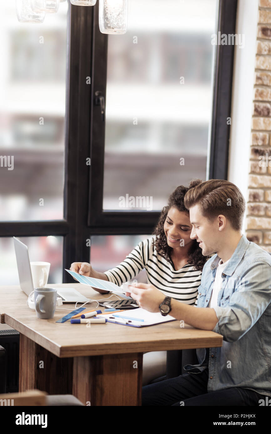 Happy young people working together Stock Photo - Alamy