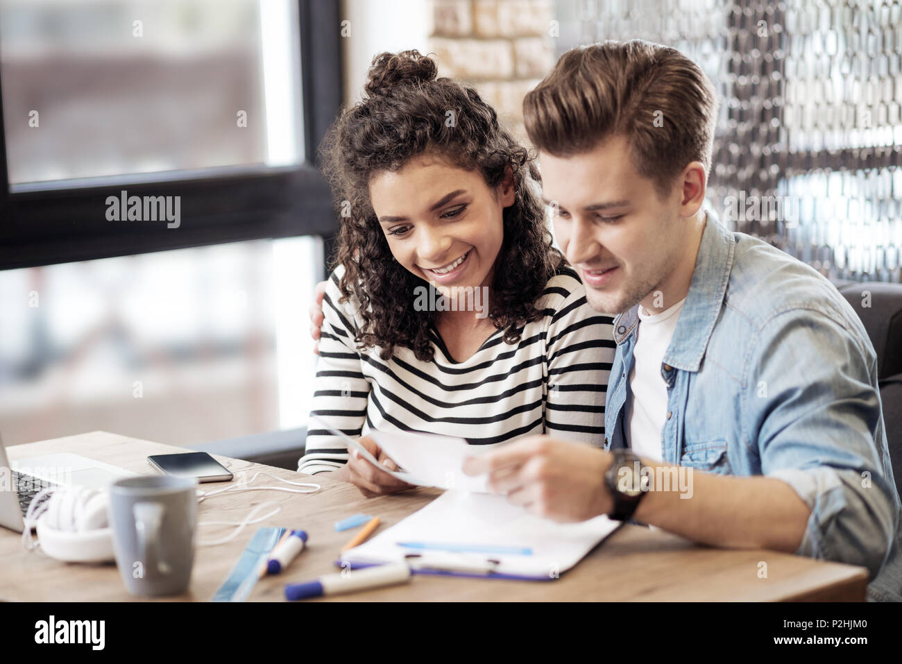 Positive nice people working in team Stock Photo - Alamy