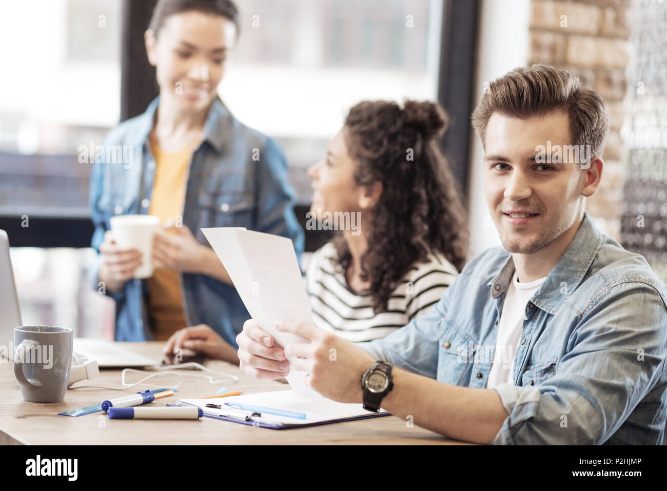 Nice young man looking at you Stock Photo - Alamy