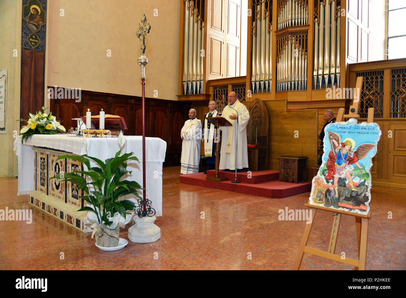 From left Padre Mark Williams, the church of St. Michael Vicenza ...