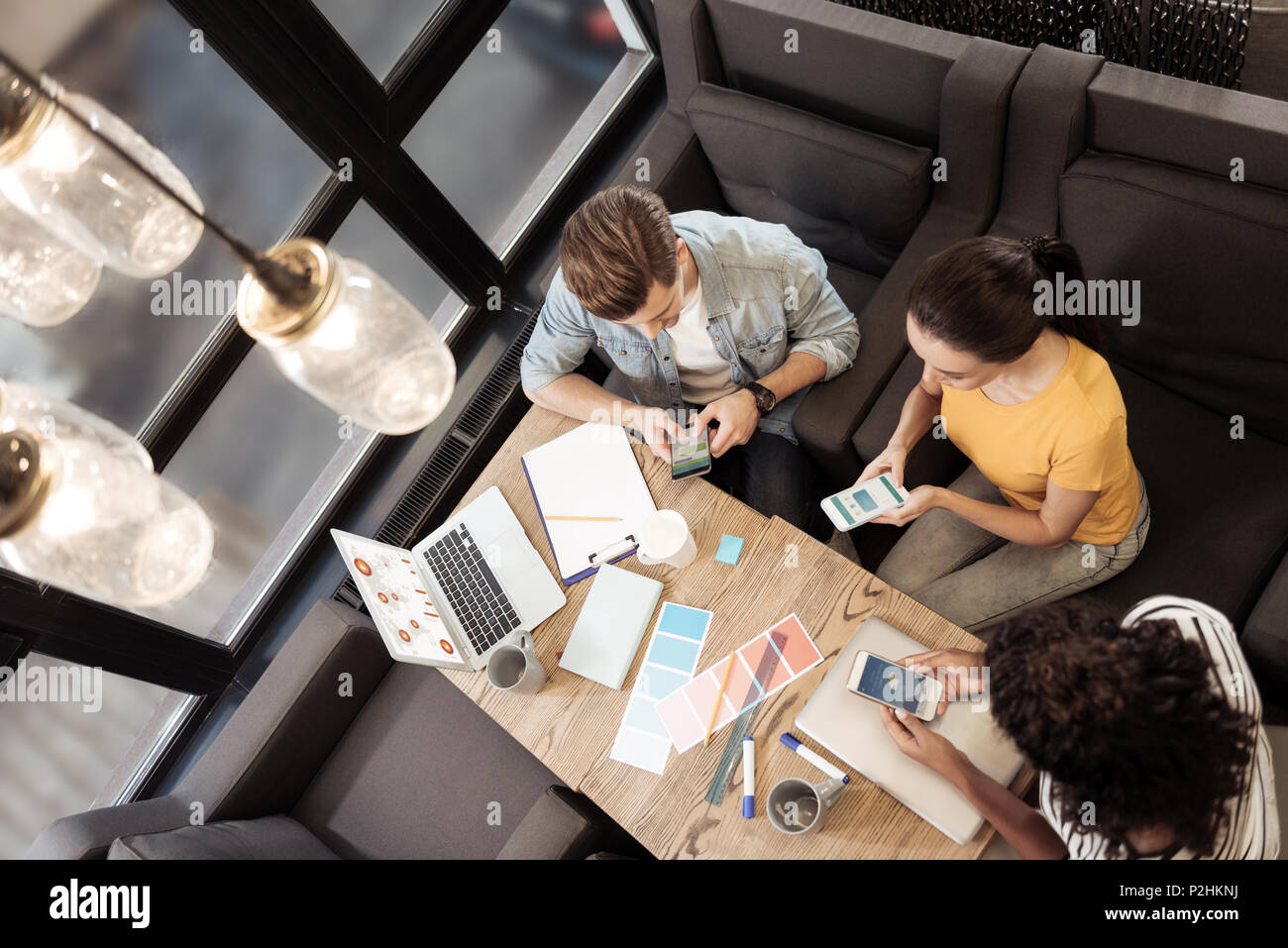 Top view of people using their gadgets Stock Photo - Alamy