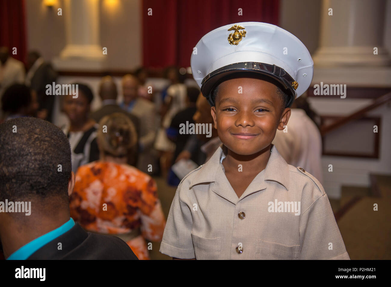 U.S. Marine Corps Master GySgt. Newtons's grandson, Elijah Newton, wears his dress blue cover ...