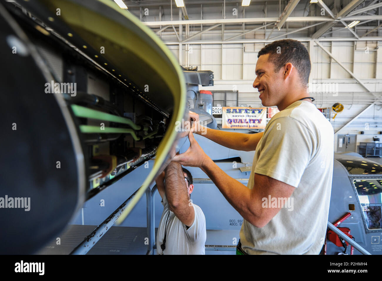 Staff Sgt. Marcus Clement, right, a crew chief with the 801st Special ...