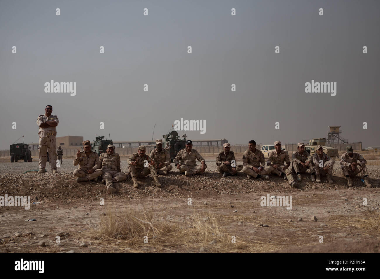 Iraqi soldiers wait for their turn to train with Spanish forces at the ...