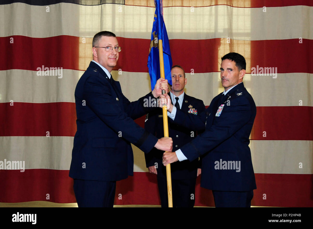 U.S. Air Force Col. Michael Troy Gerock (right) accepts command of the ...