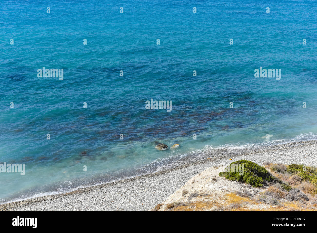 Pebble stone beach in Cyprus, a popular tourist resort Stock Photo - Alamy