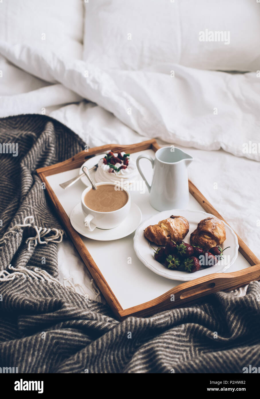 Traditional romantic breakfast in bed in white and beige bedroom Stock ...