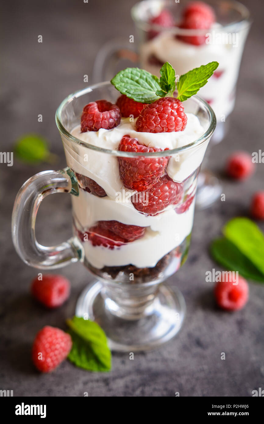 Delicious layered raspberry trifle in a glass jar Stock Photo - Alamy