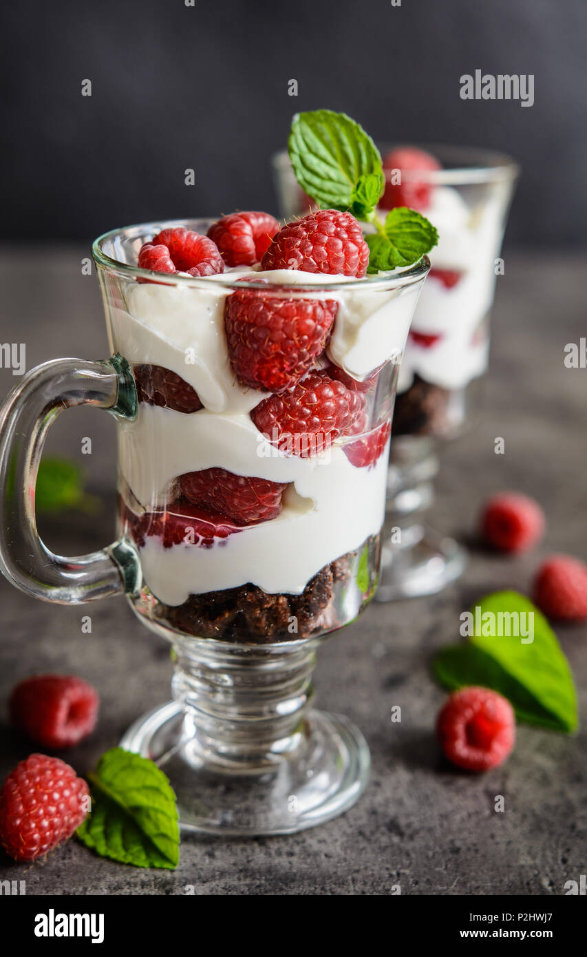 Delicious layered raspberry trifle in a glass jar Stock Photo - Alamy