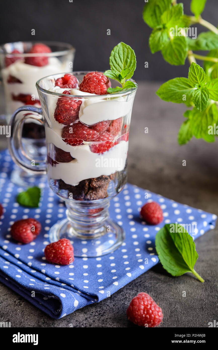 Delicious layered raspberry trifle in a glass jar Stock Photo - Alamy