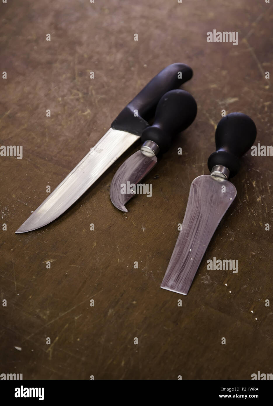 Knives for cutting cheese, detail of tools for cheese Stock Photo - Alamy