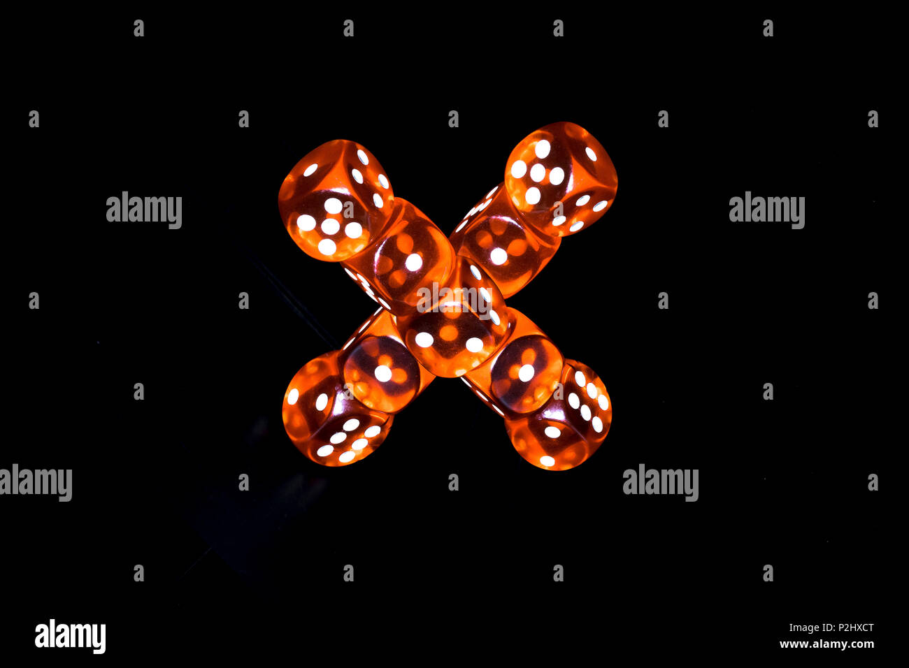 red and white X or a cross of dices on the blackboard background image ...