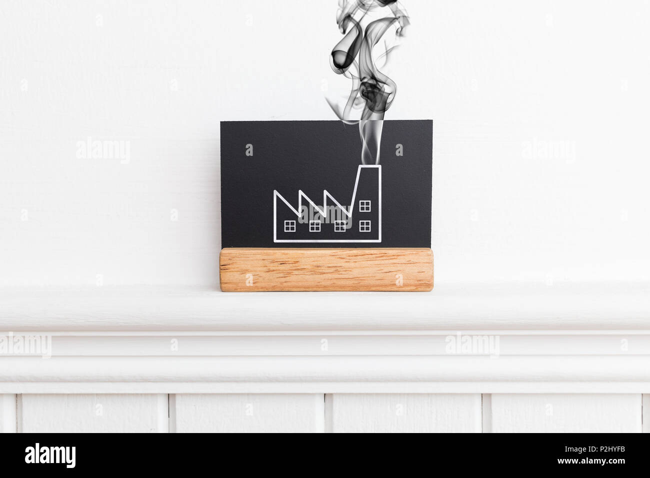 creative image of a wall with Factory emitting smoke. Smoking factory ...