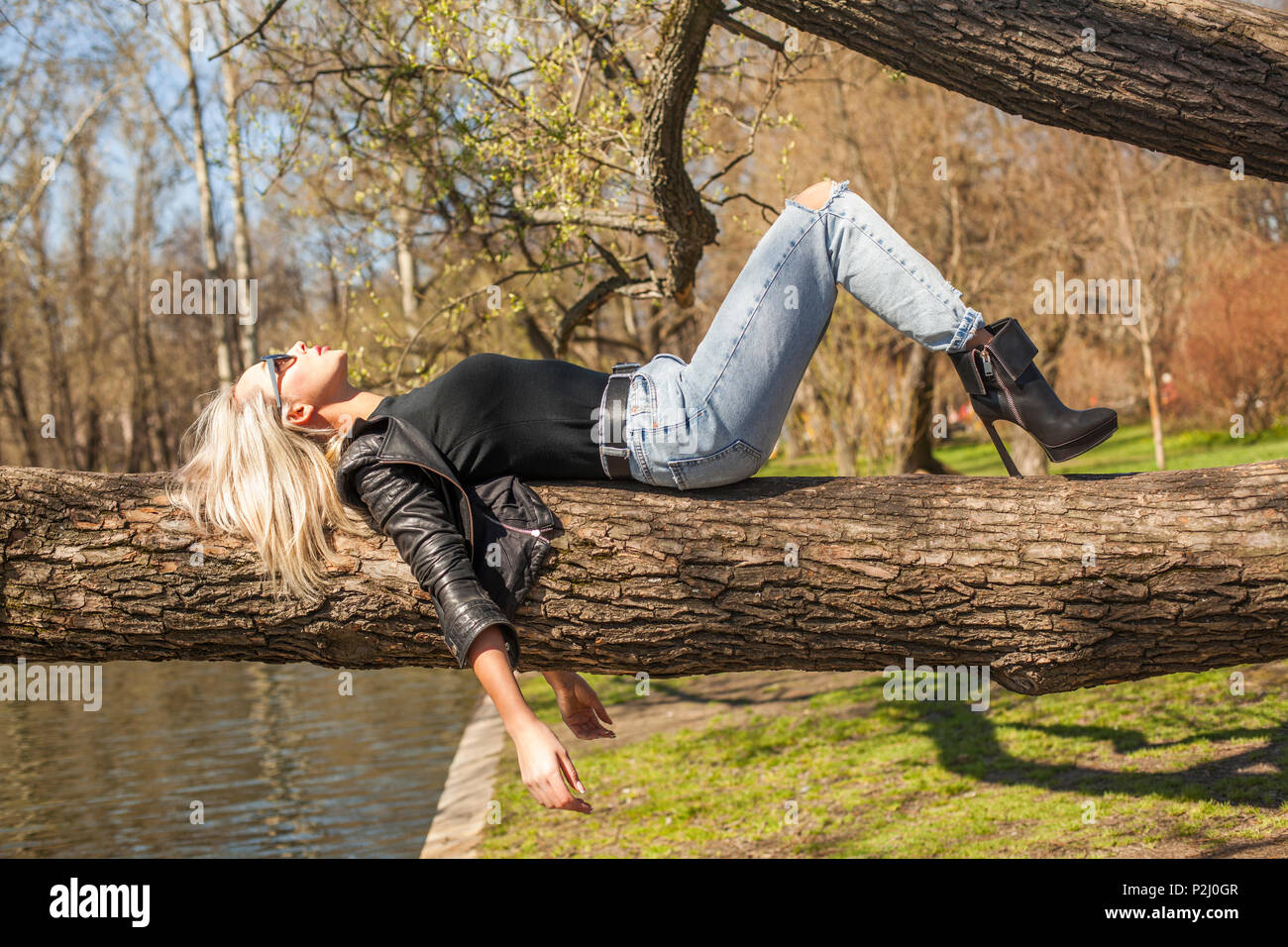 Fashion Model Woman resting in park outdoors Stock Photo - Alamy