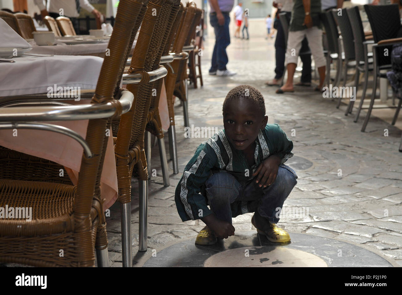 Crouching child hi-res stock photography and images - Alamy