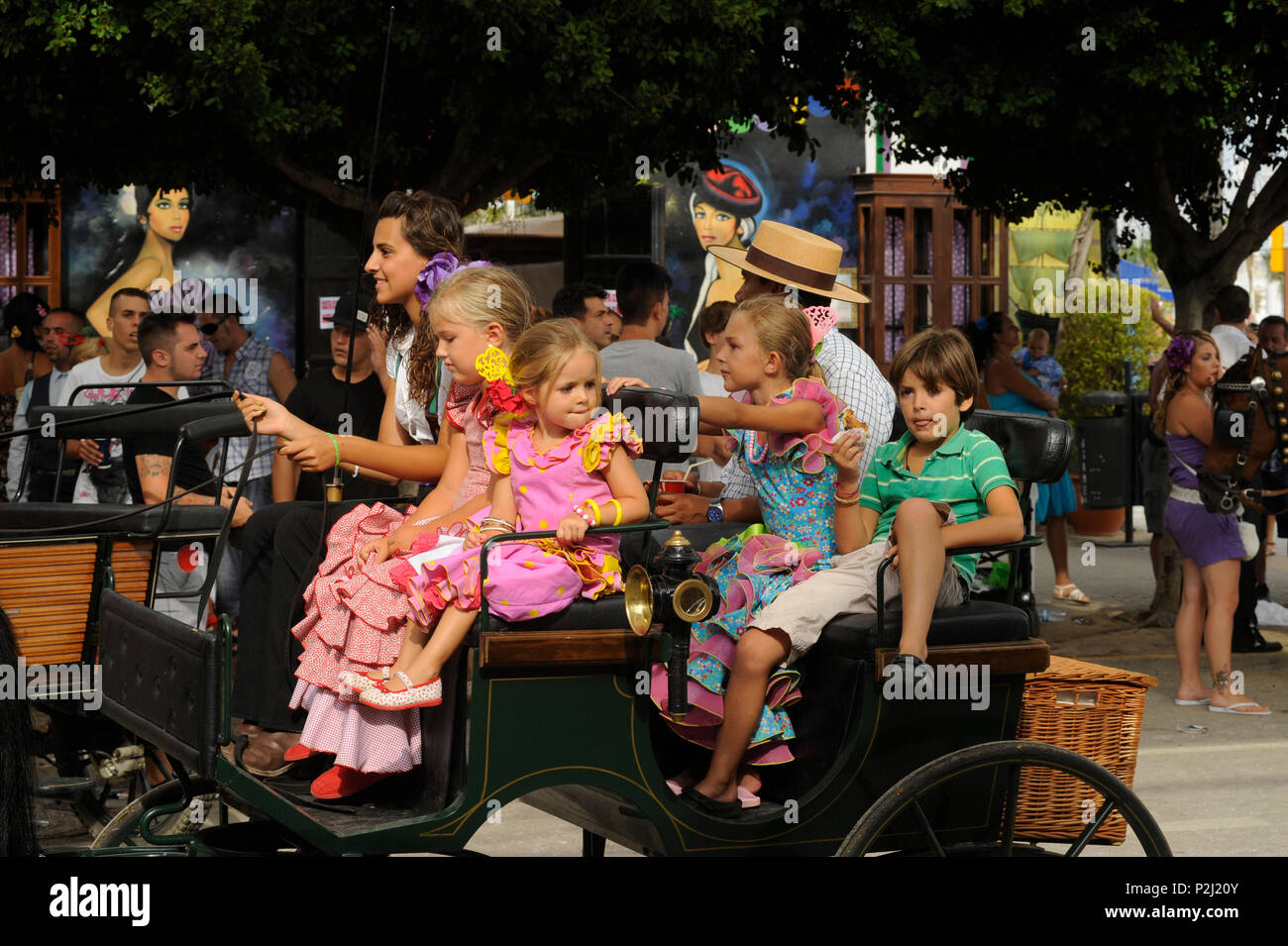 Family with children wearing Flamenco dresses at the Freia de Malaga ...