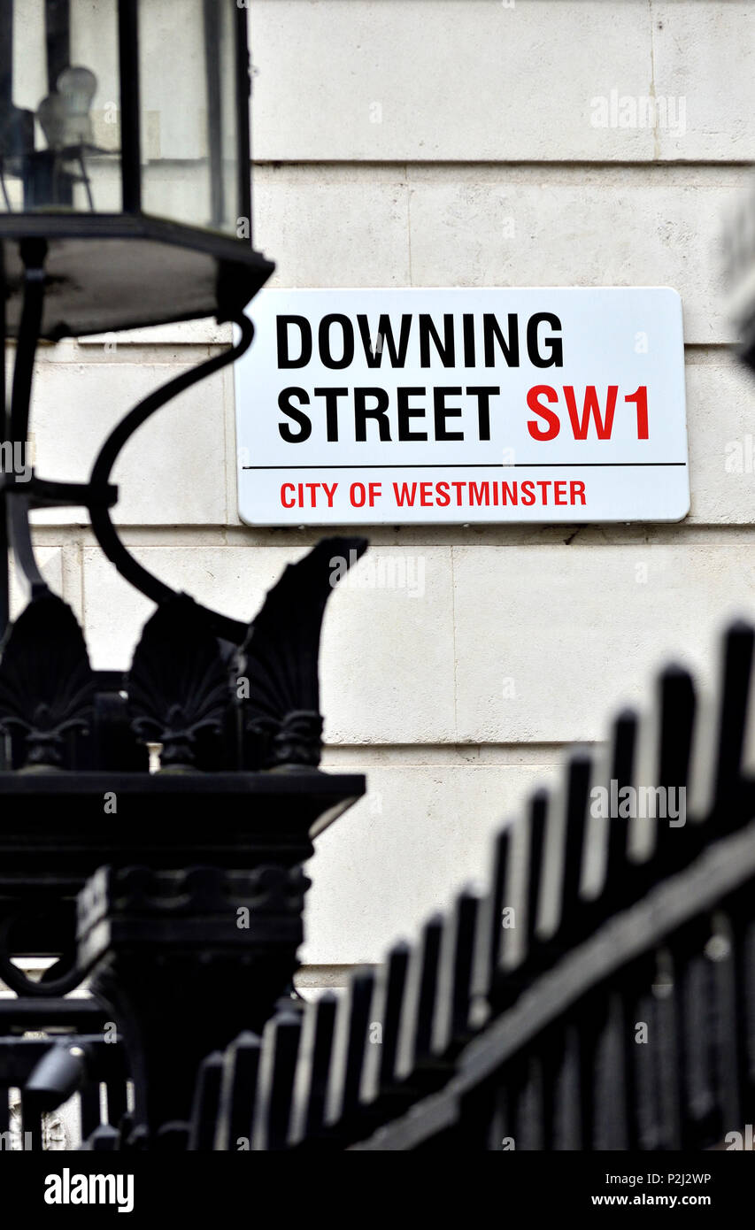 Downing Street sign behind security gates, Westminster, London, England ...