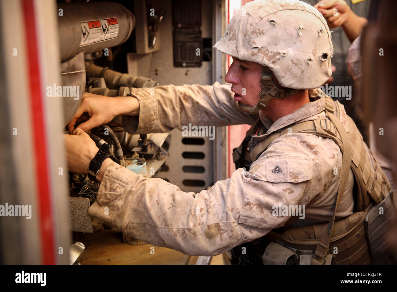 Marines assigned to Task Force Taqaddum conduct a systems check on a ...
