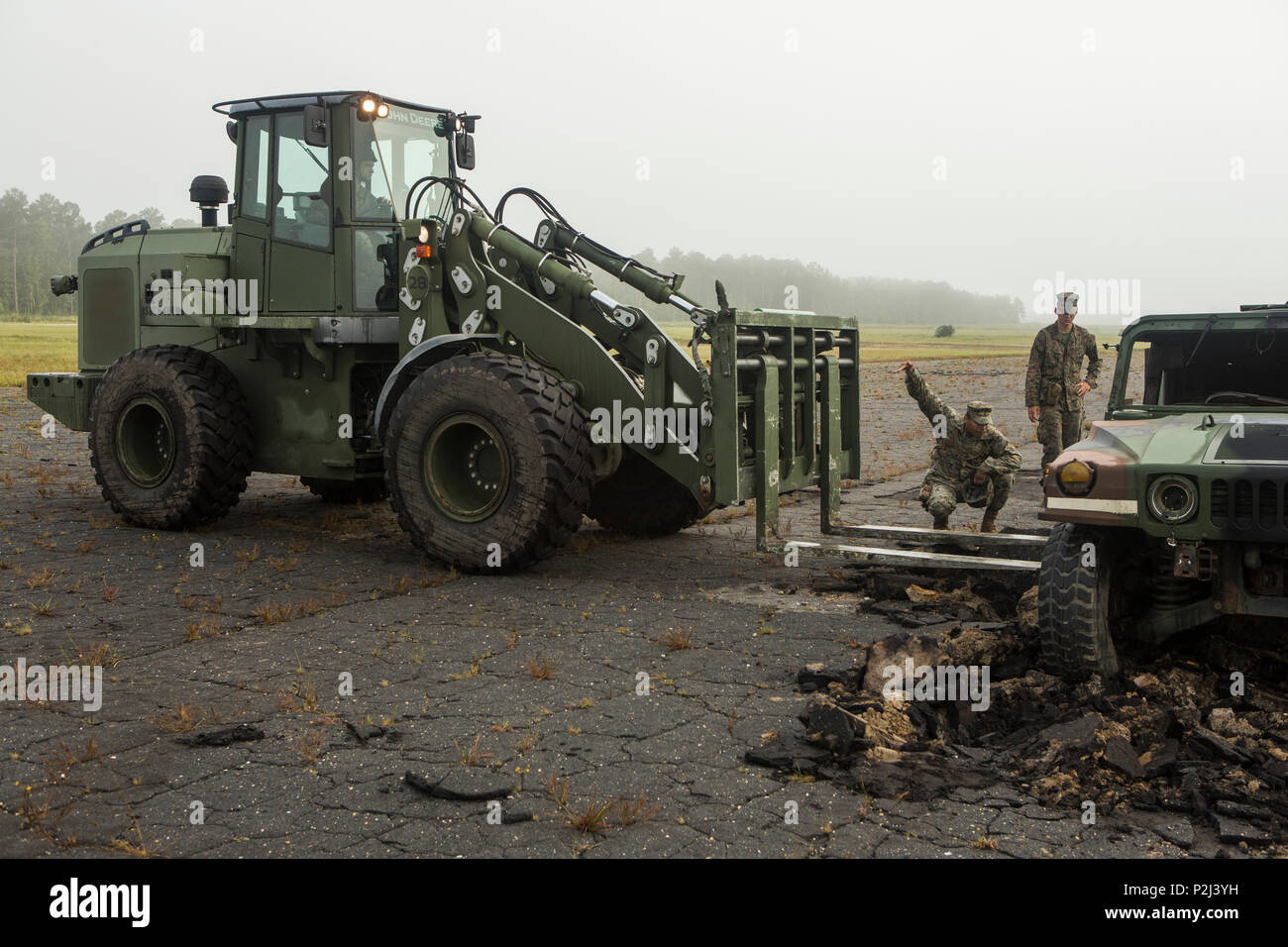 U.S. Marine Corps Gunnery Sgt. Daniel Sanchez, center, a drafter and ...