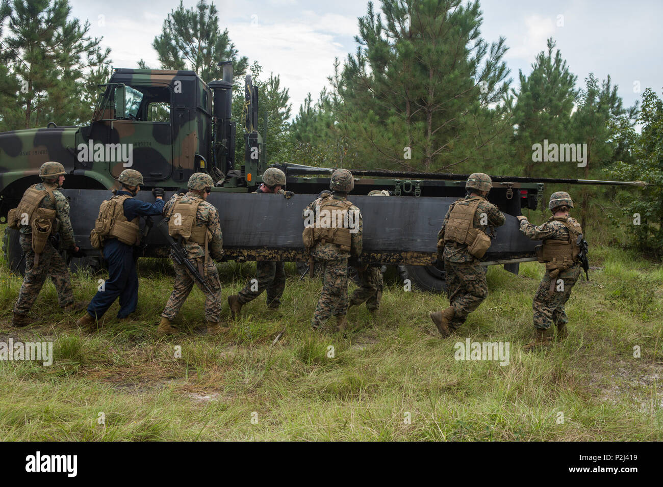 U.S. Marines assigned to Marine Wing Support Squadron (MWSS) 274, carry ...