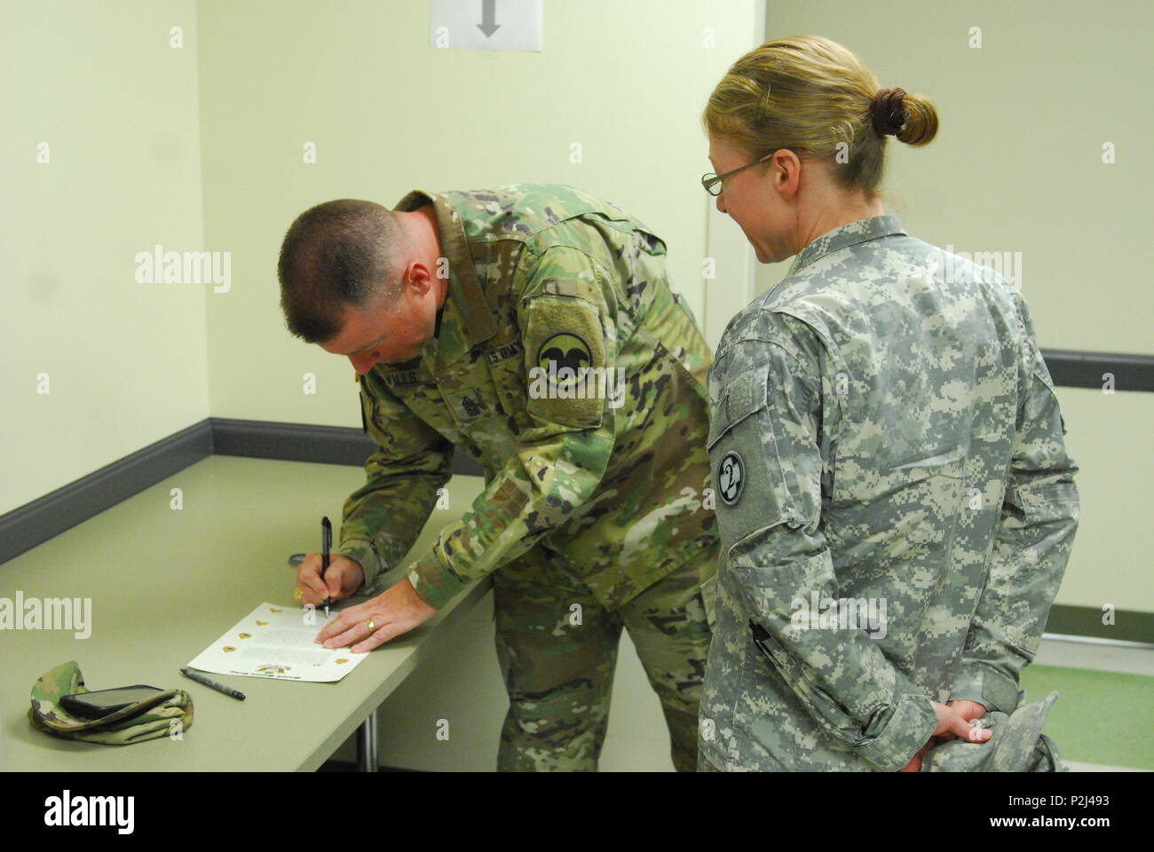 Army Reserve Command Sgt. Maj. James P. Wills, signs autographs for ...