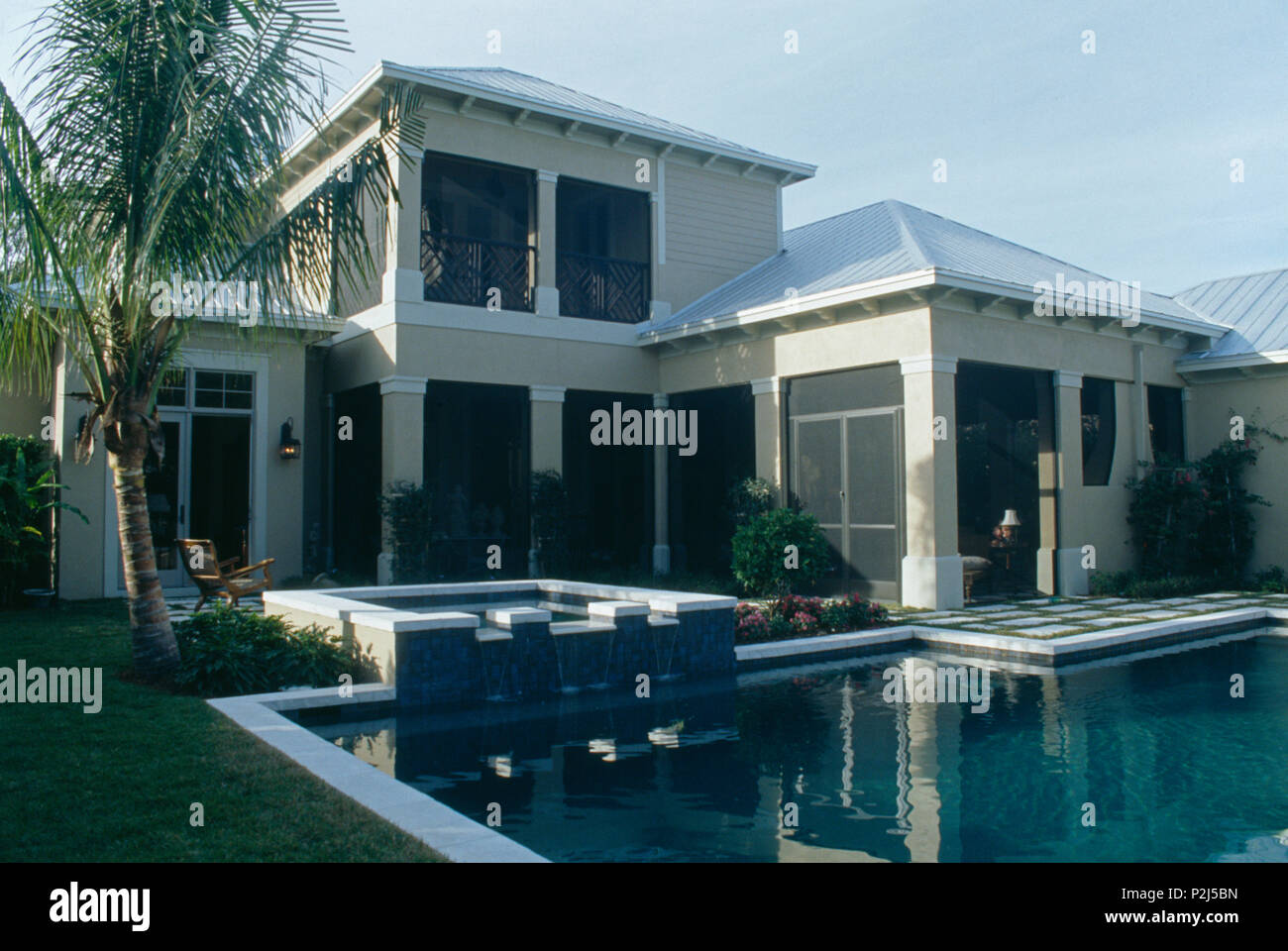 Swimming pool in front of modern villa in Florida Stock Photo - Alamy