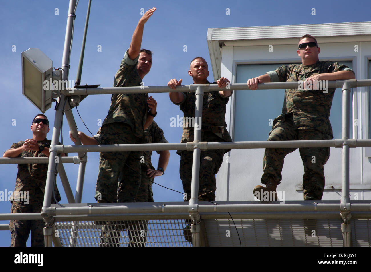 Brig. Gen. Matthew Glavy stands on top of a control tower with Lt. Col ...