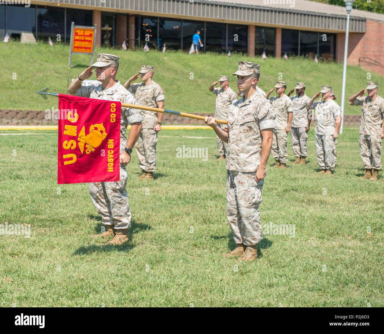 U.S. Marine Corps Capt. Peter Ciaston and Sgt. Dylan Pierce, salutes as ...