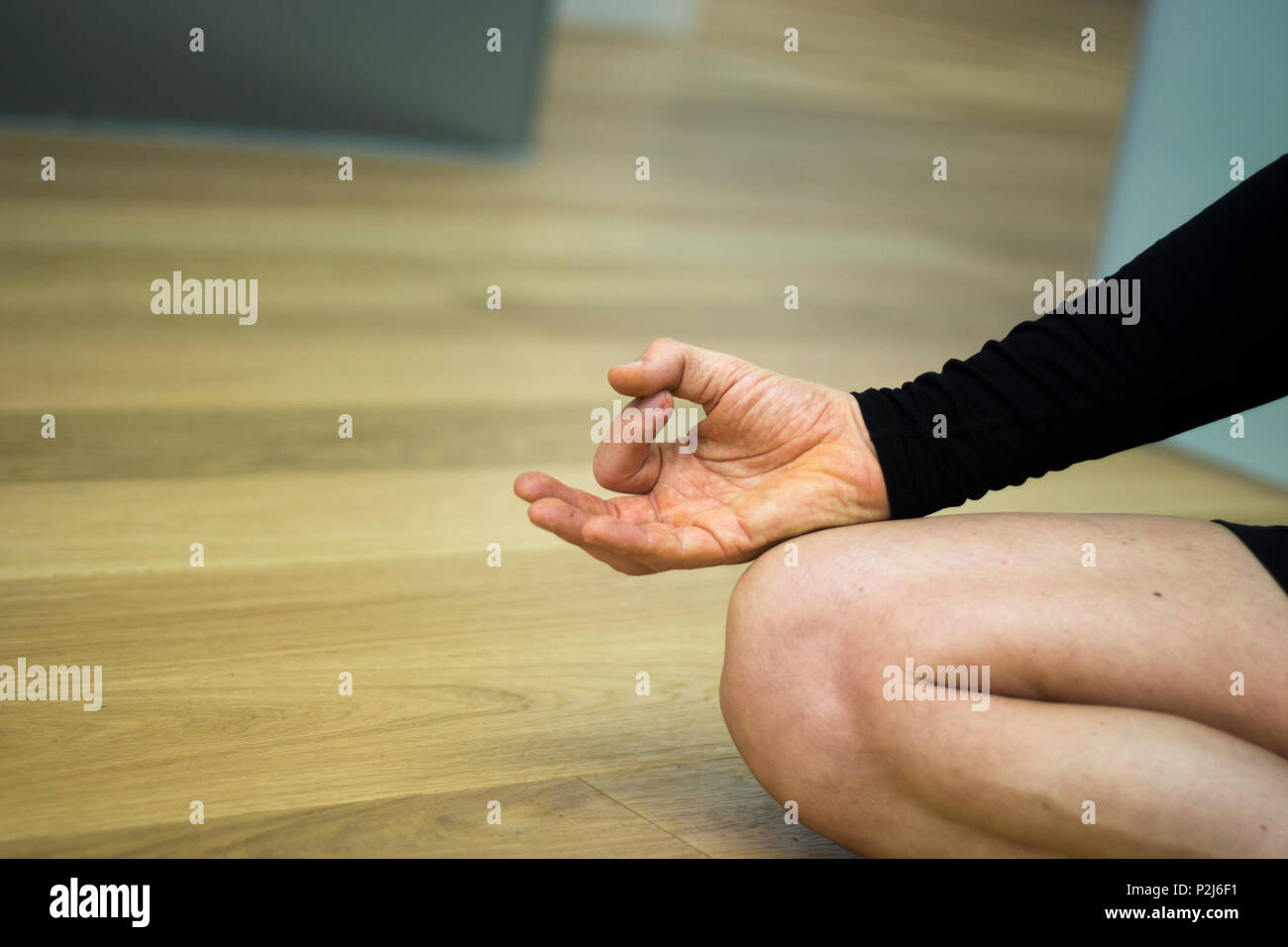 Male instructor yoga teacher teaching asana pose with mudra hand ...