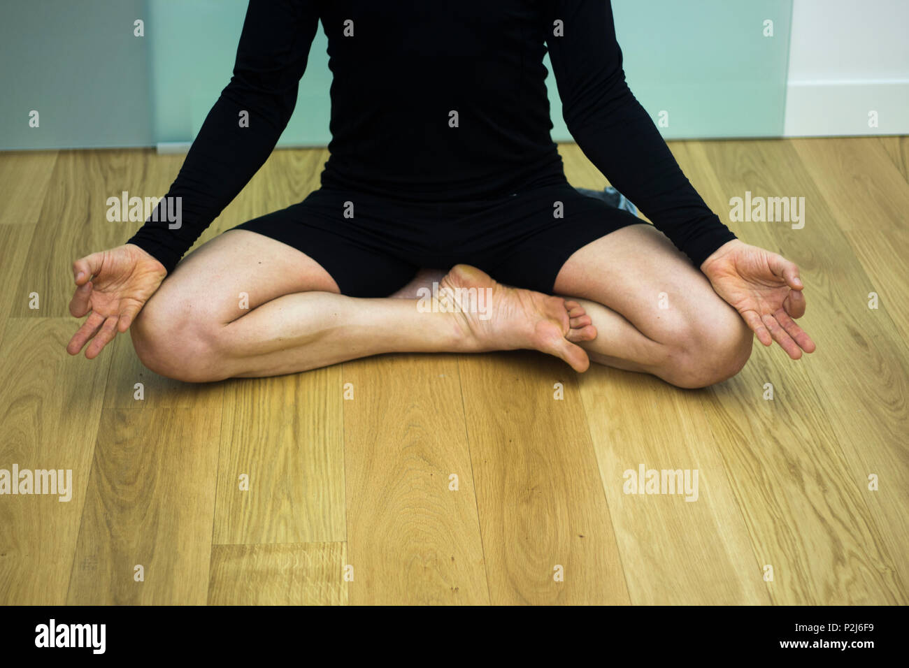 Male instructor yoga teacher teaching asana pose with mudra hand ...