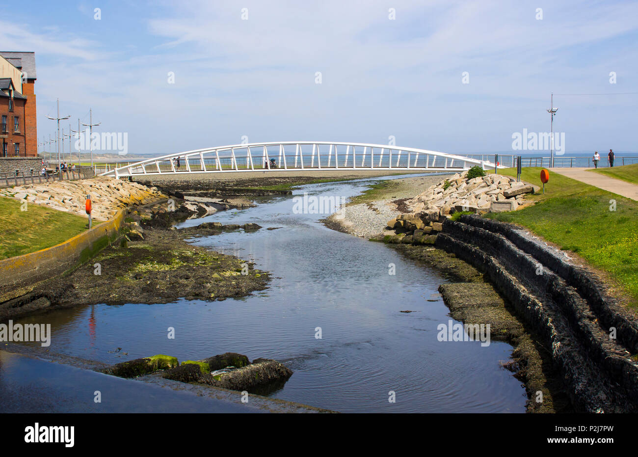7 June 2018 Visitors crossing the modern footbridge at the mouth of the ...