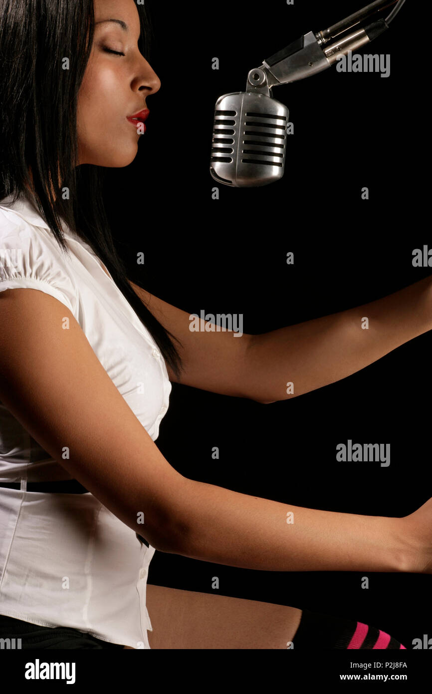 Singing into mic hi-res stock photography and images - Alamy