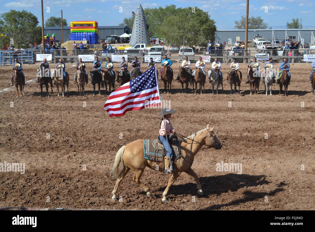 Participants in the Day’s Work Ranch Rodeo in Dell City, Texas, hold ...