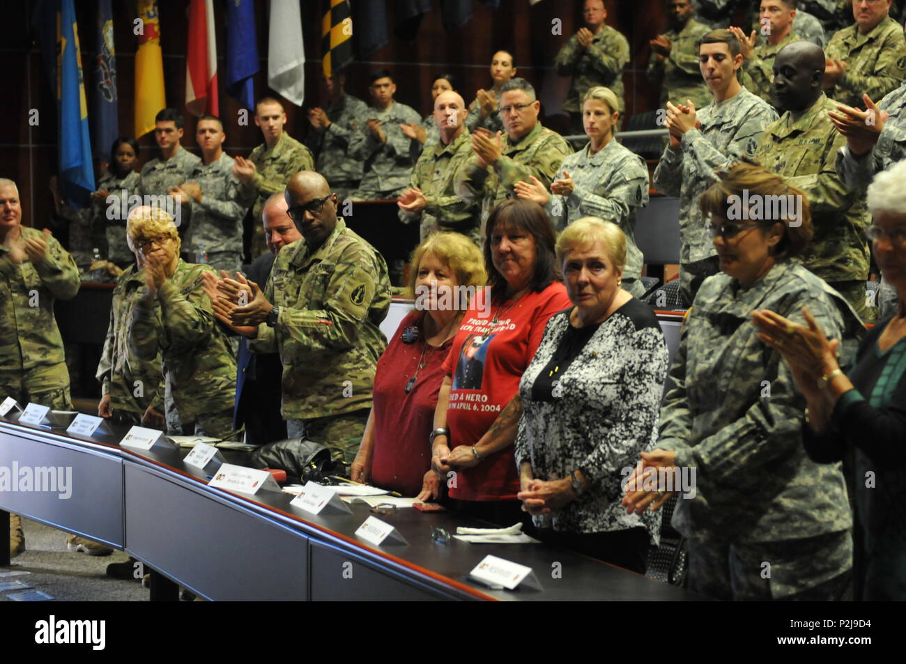 Soldiers from the 63rd Regional Support Command give standing applause ...