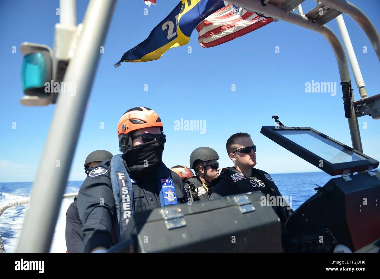 A joint boarding team returns to USCGC Sequoia (WLB-215) following a ...