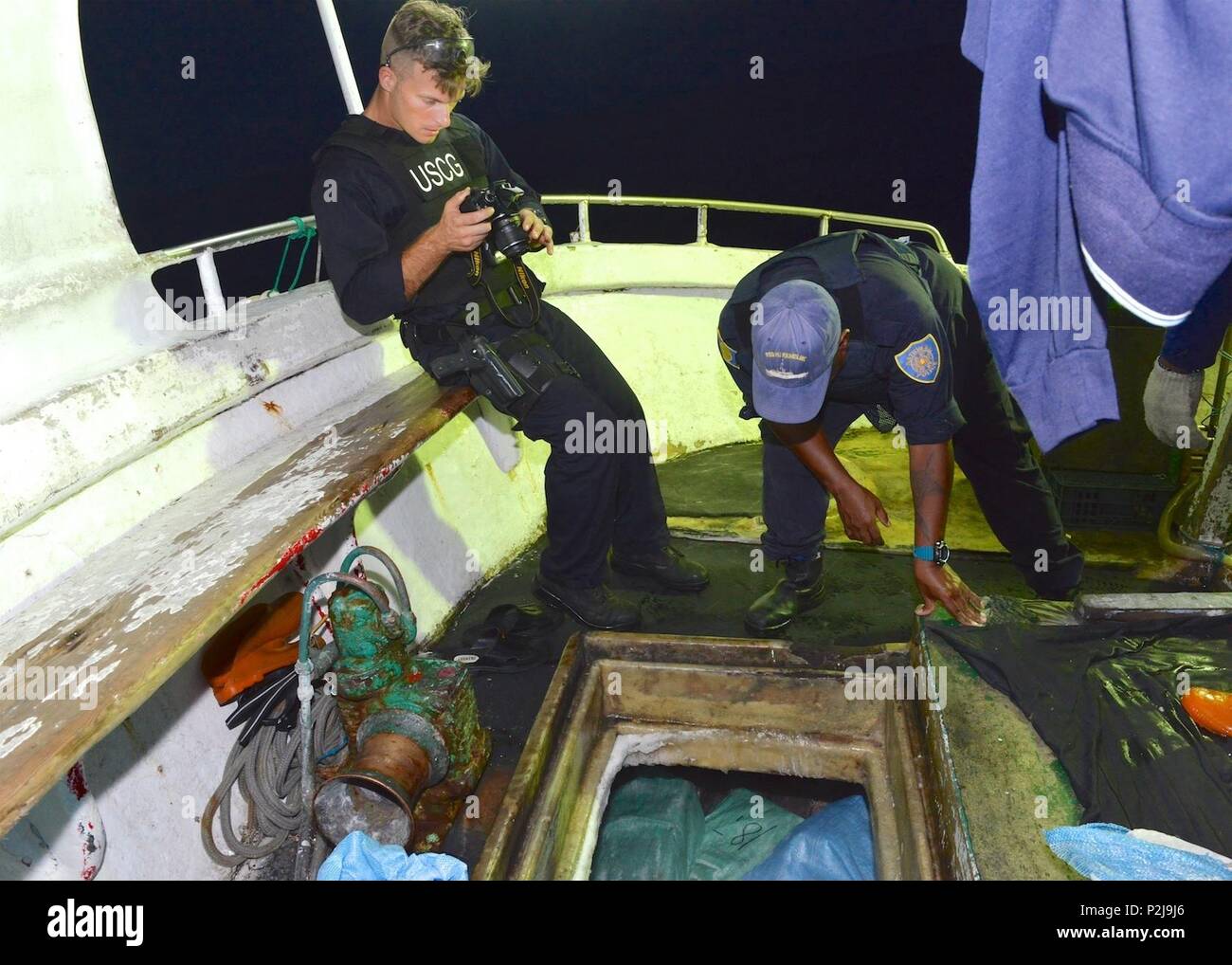 U.S. Coast Guard Petty Officer 1st Class Brett Malone, a damage ...