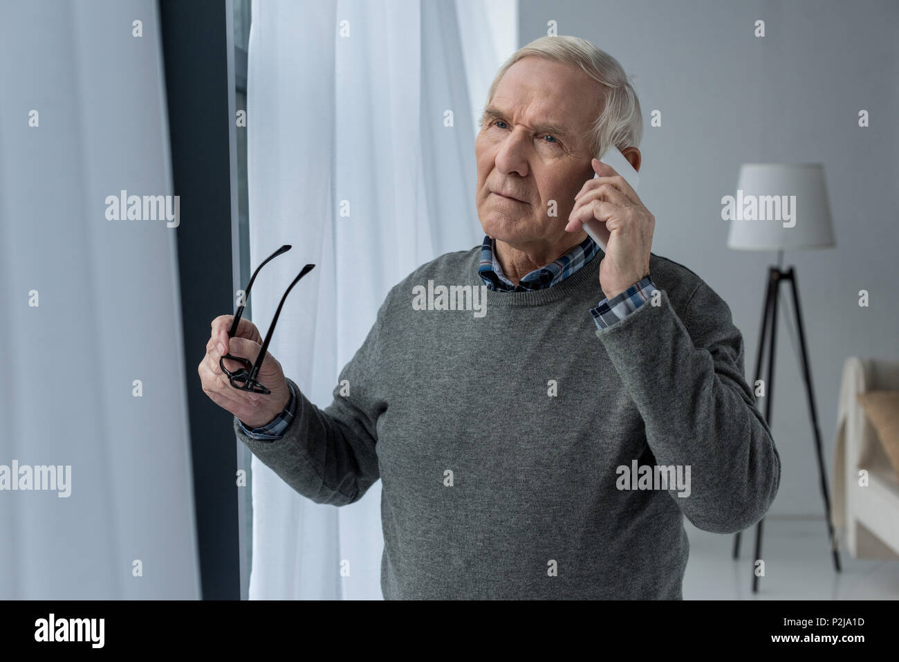Old people making a phone call hi-res stock photography and images - Alamy