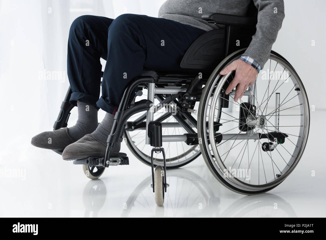 Close-up view of senior man hand on wheel of wheelchair Stock Photo - Alamy