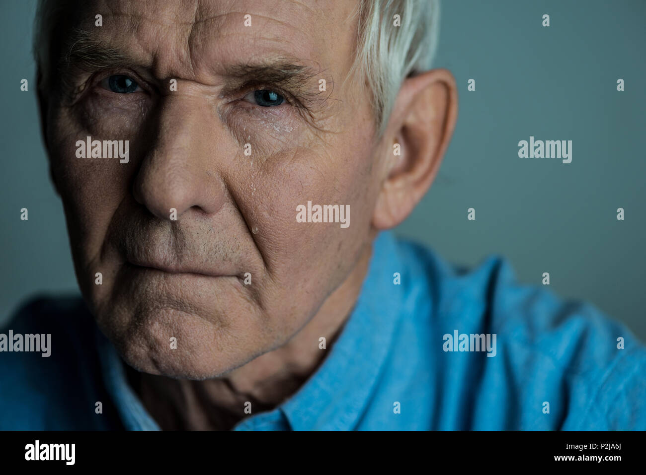 Sad retired male looking camera hi-res stock photography and images - Alamy
