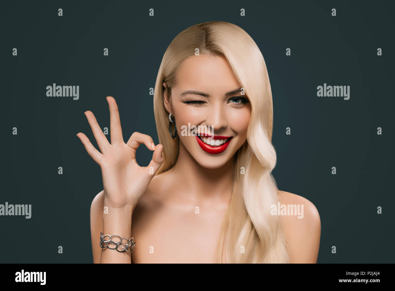 Portrait cheerful girl winking showing hi-res stock photography and ...