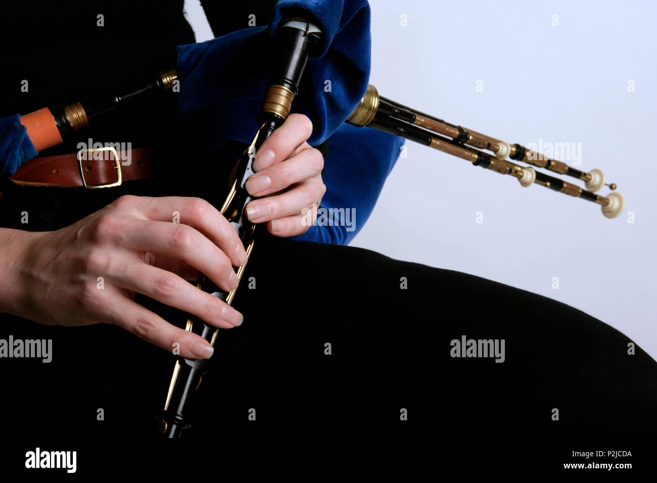 Young woman playing the Northumbrian Pipes Stock Photo - Alamy