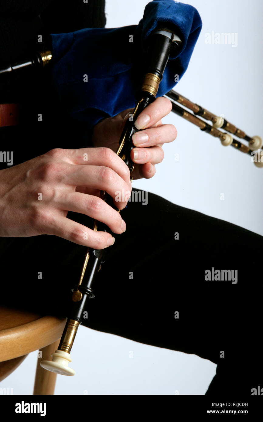 Young woman playing the Northumbrian Pipes Stock Photo - Alamy