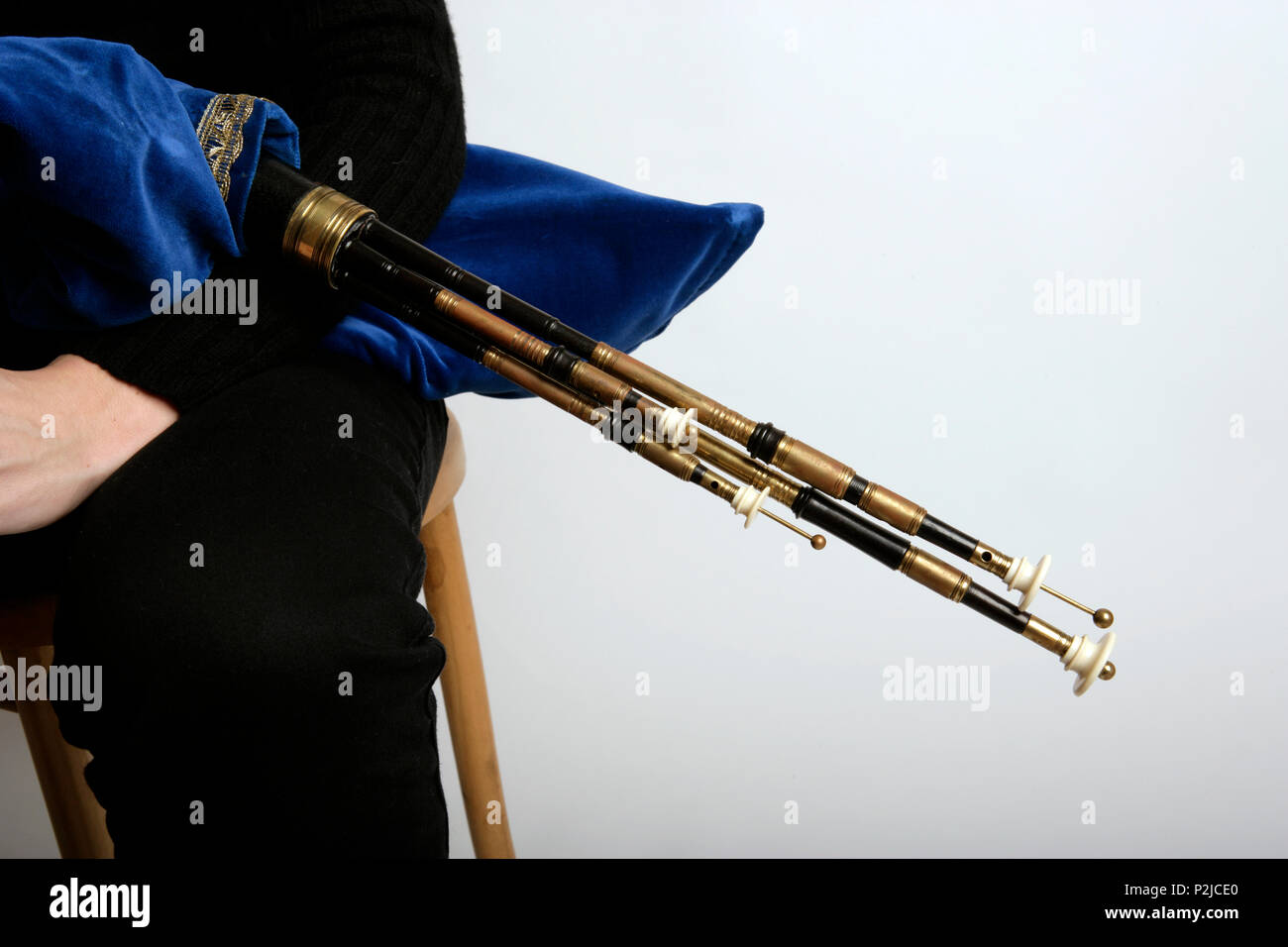 Young woman playing the Northumbrian Pipes Stock Photo - Alamy