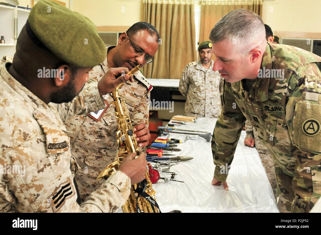 A Royal Saudi Land Forces musician and instrument technician gives Capt ...