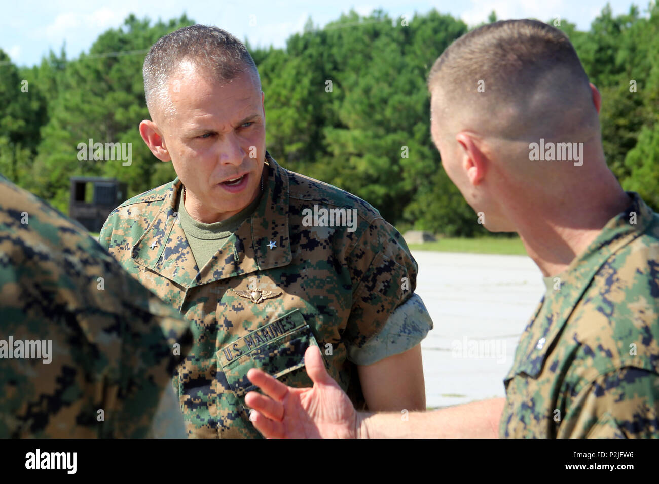 Brig. Gen. Matthew Glavy listens to Lt. Col. Steven Schultze during a ...