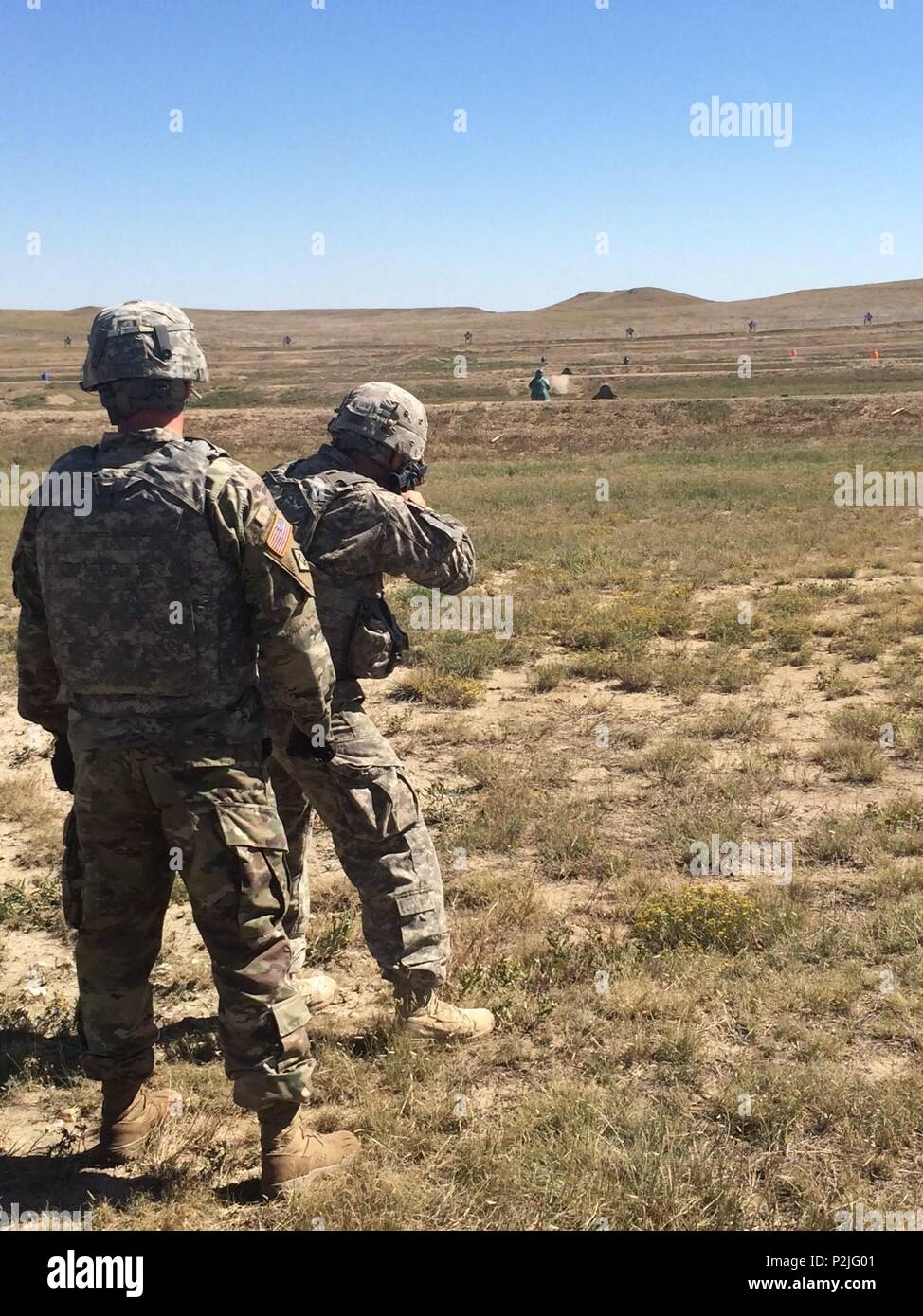 SFC Gibson observes SGT Swan as he engages a target during HHC's ...