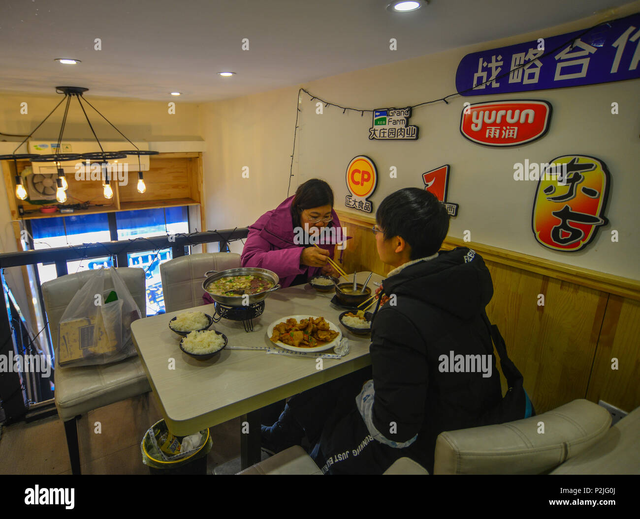 Harbin, China - Feb 22, 2018. People eating at local restaurant in ...