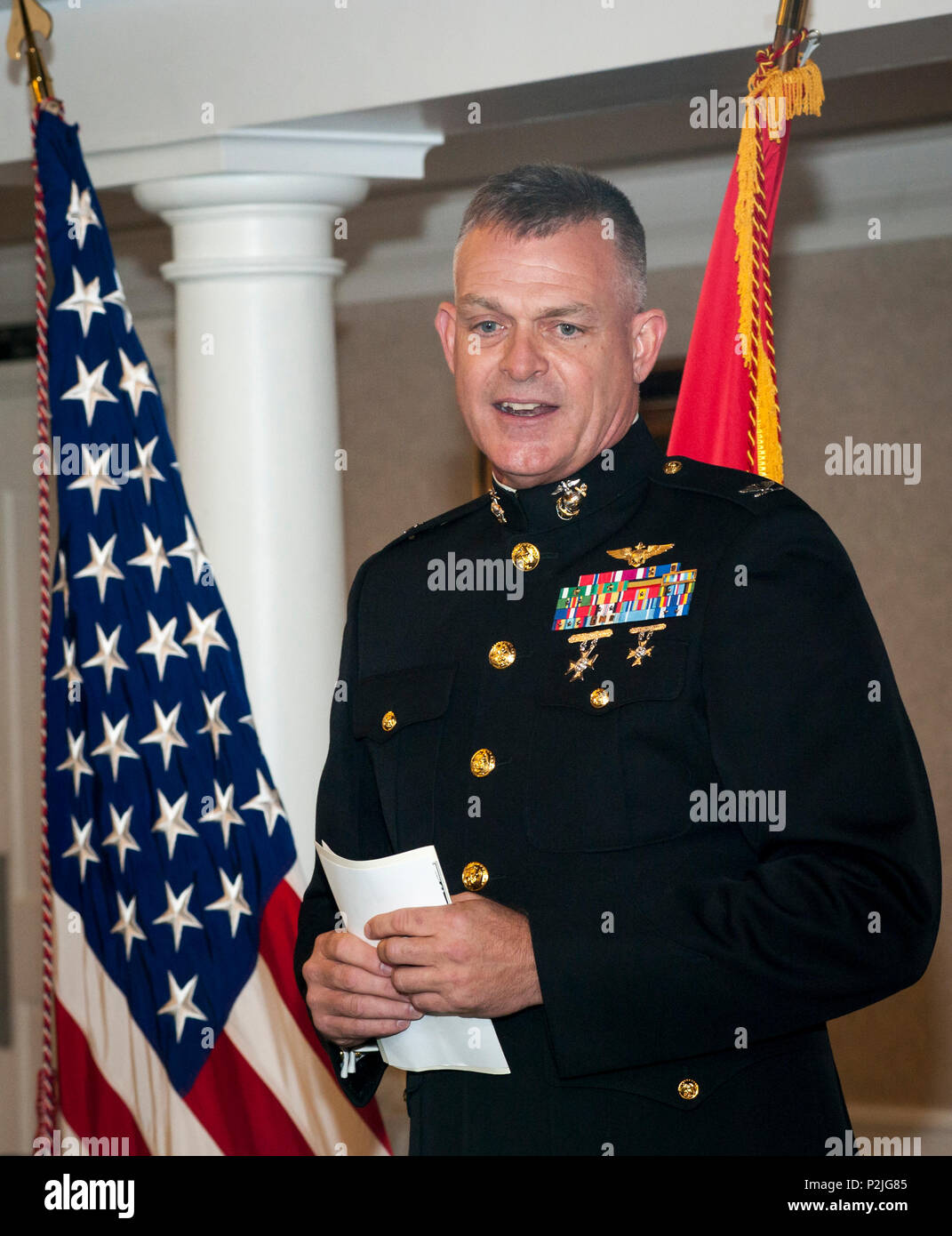 U.S. Marine Corps Col. Michael Ulses gives a speech in honor of retiree ...