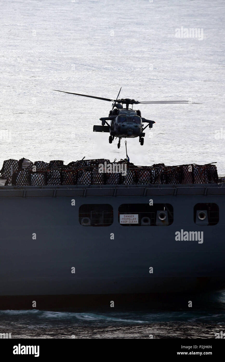 MH-60S Sea Hawk helicopters from HSC-26, the Chargers, perform vertical ...