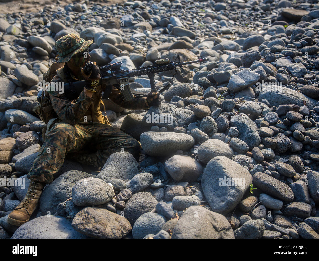 PAPENOO, Tahiti – U.S. Marine Cpl. Ryan Heuerman, a combat engineer ...